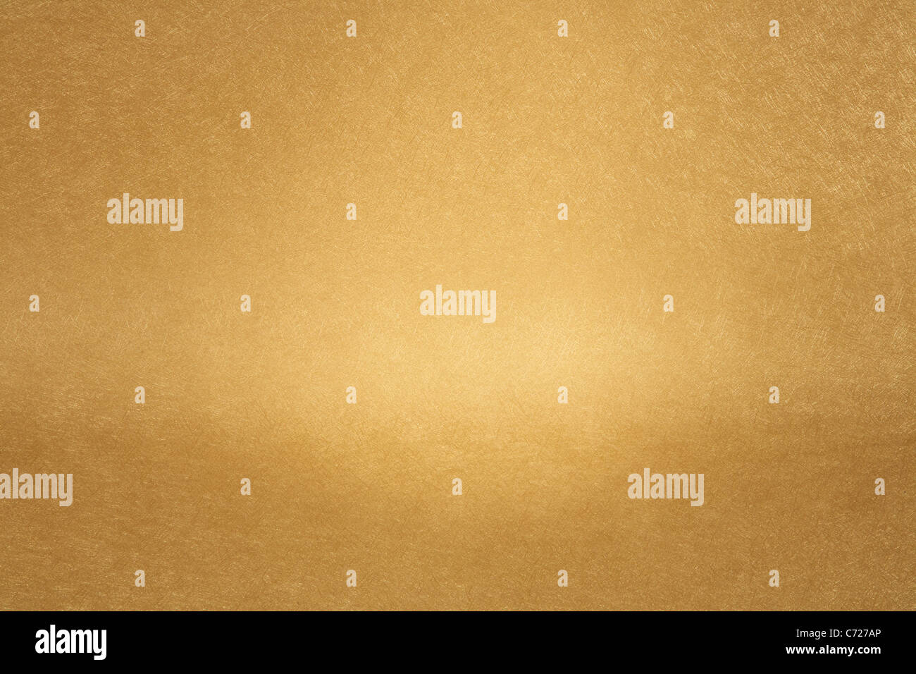 golden textured paper illuminated at still life Stock Photo - Alamy