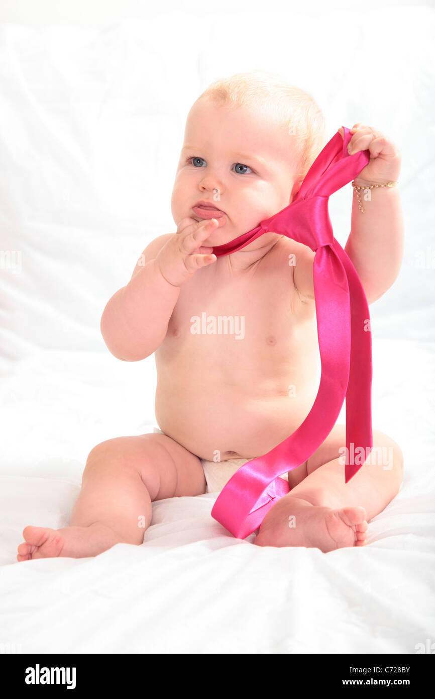 cute baby wearing a pink tie Stock Photo - Alamy