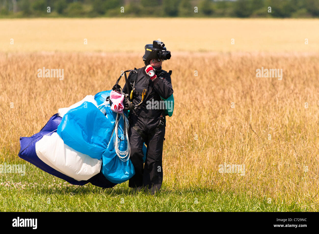 A Parachute jumper with cameras fixed to his helmet who films the other ...