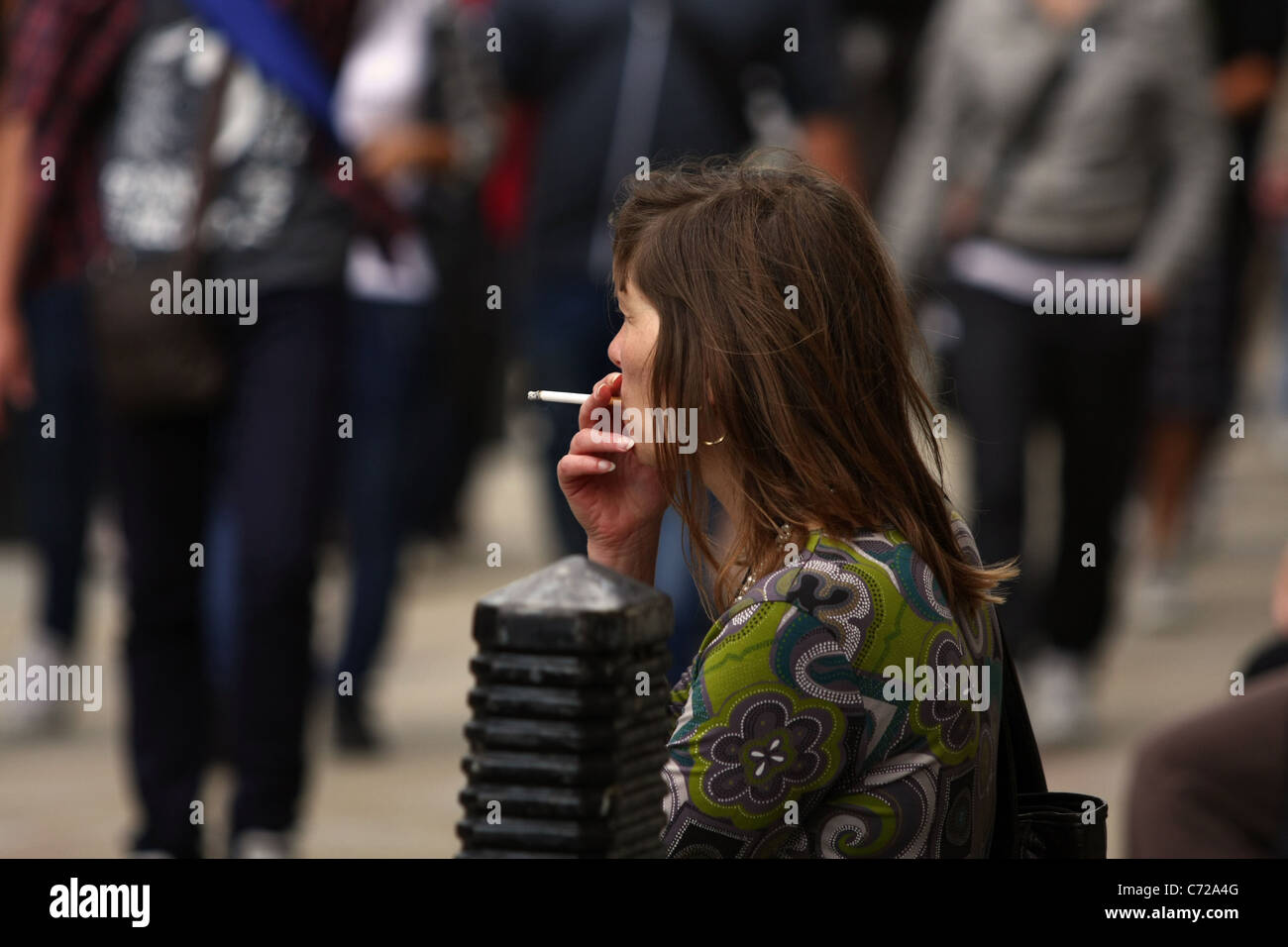Female smoker stubs out cigarette hi-res stock photography and images ...