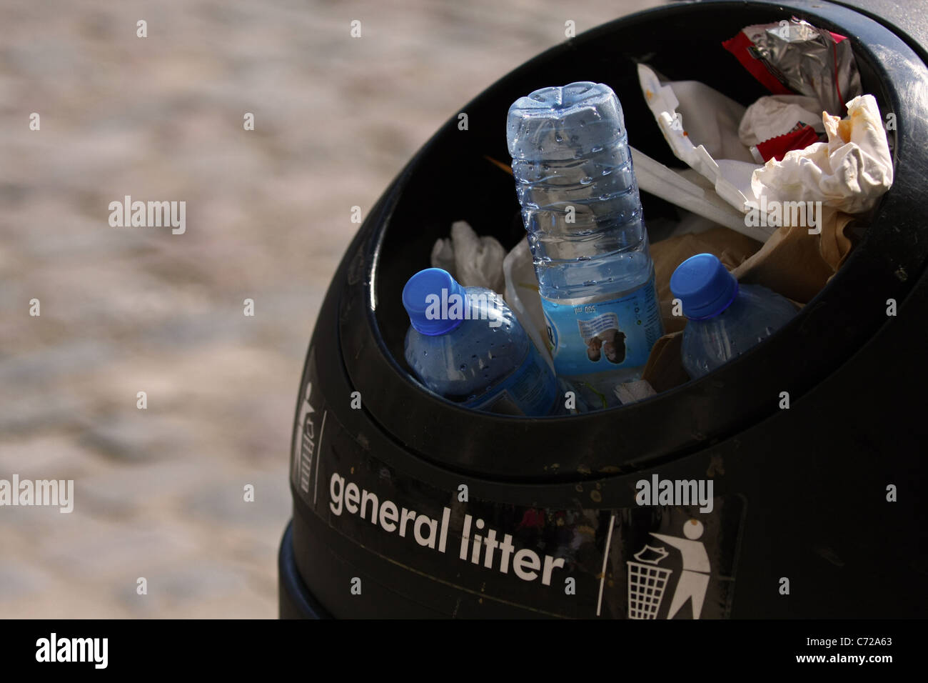 a public litter bin full of rubbish Stock Photo - Alamy