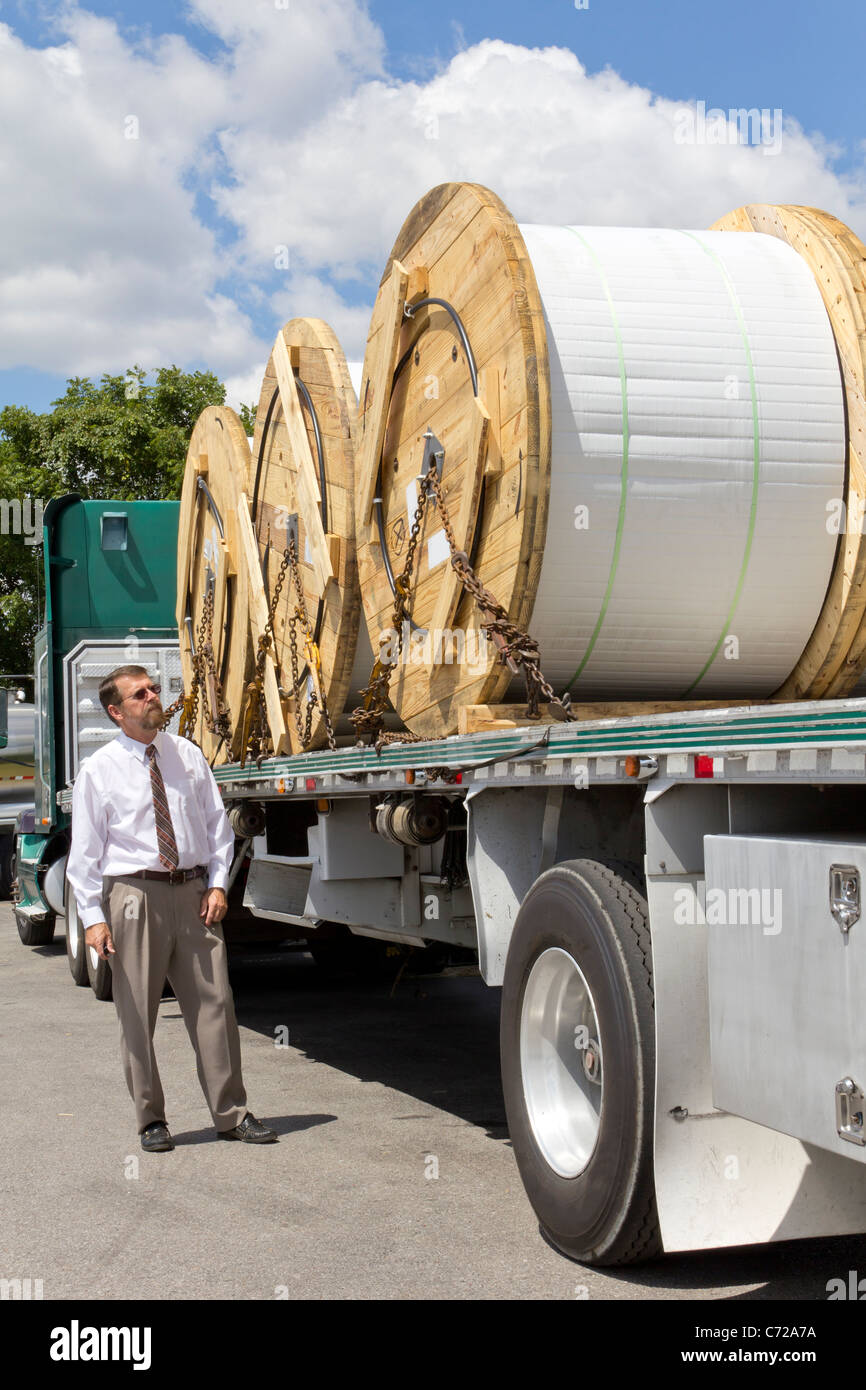 Truck bringing a load of Fiber-optic communication cable Stock Photo ...