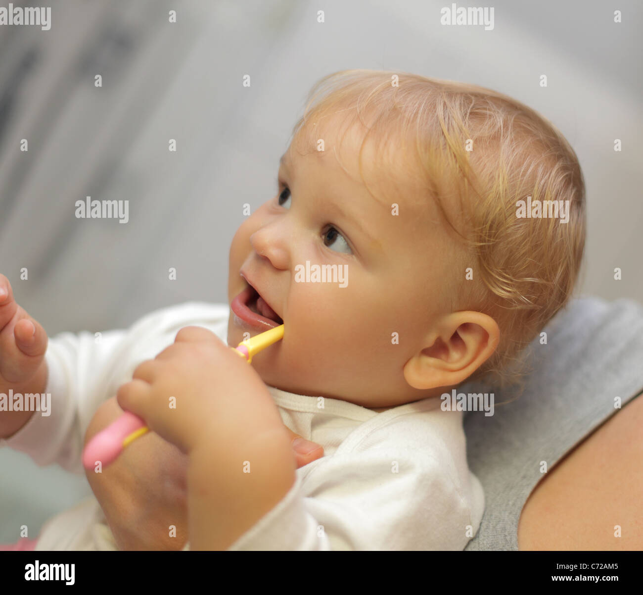 Cute baby girl brushing her teeth Stock Photo - Alamy