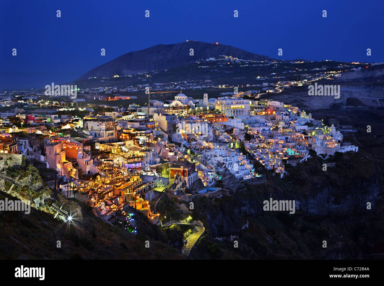 Night view of Fira village, the "capital" of Santorini island, hanging ...