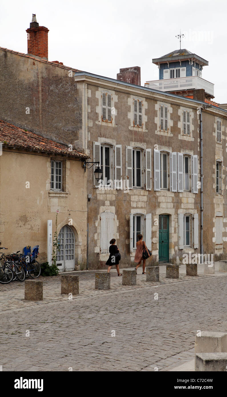 French street scene showing a shuttered house and two women walking ...