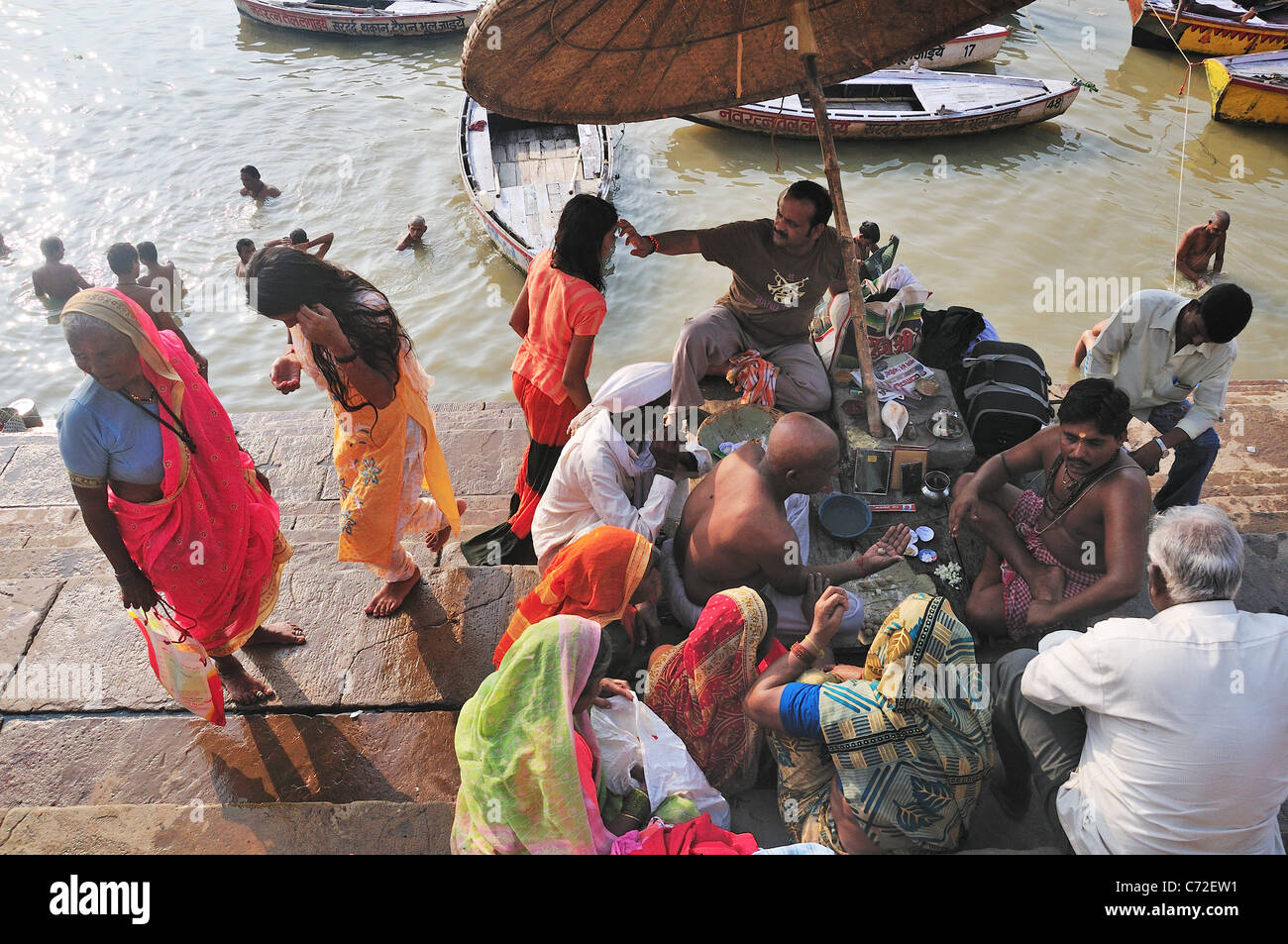 Pilgrims at the ghat by the Ganges river Stock Photo - Alamy