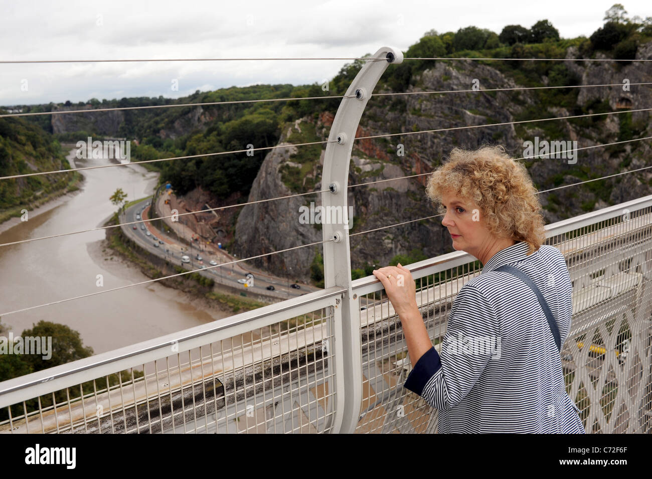 Woman scared of heights looks worried on the Clifton Suspension Bridge ...
