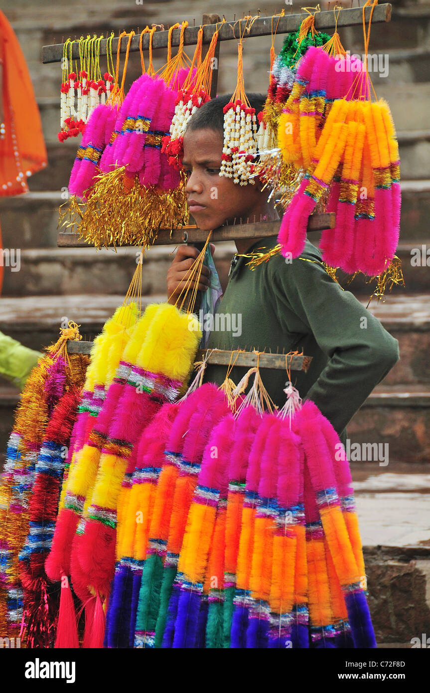 Young boy working all day long by the ghat Stock Photo - Alamy