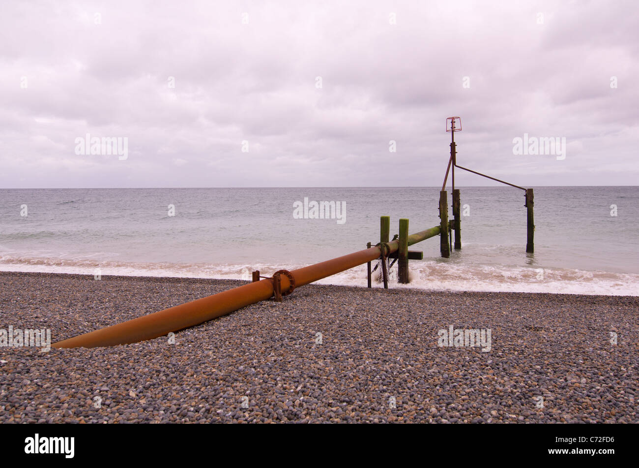 Sheringham beach sewerage pipe hi-res stock photography and images - Alamy