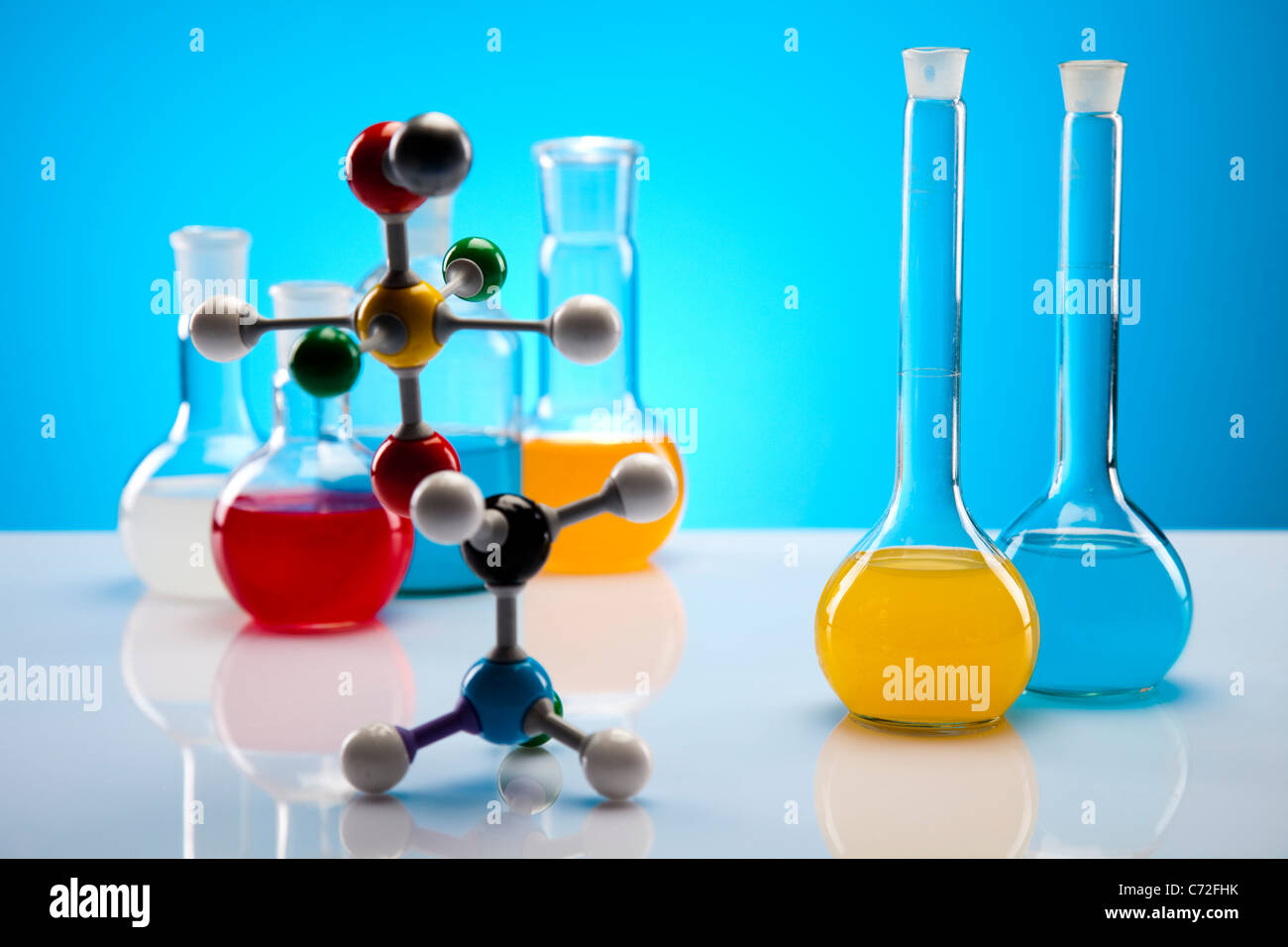 Molecular model and flasks in laboratory Stock Photo - Alamy