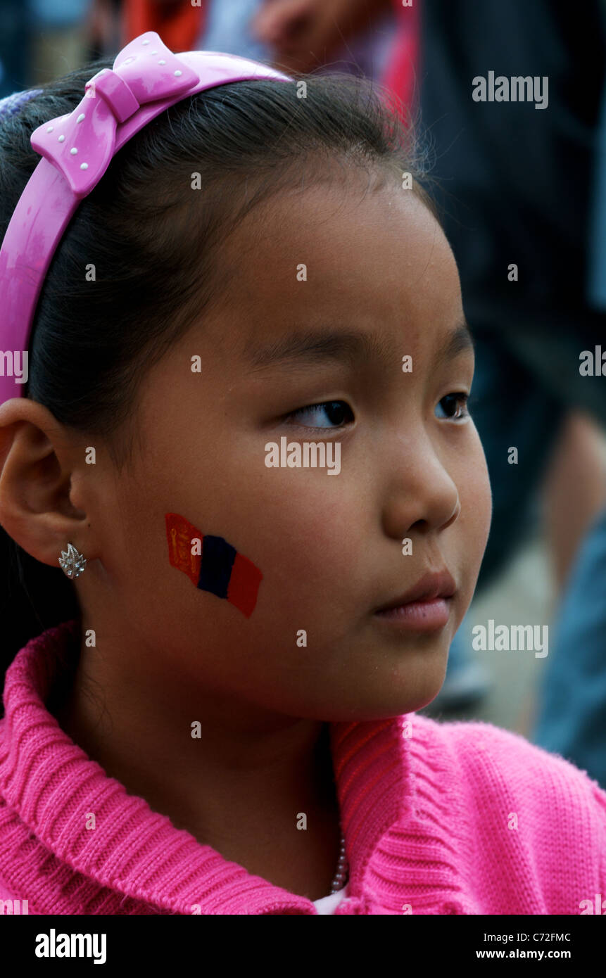 Mongolian girl w/ Mongolian flag painted on face, Naadam Festival ...