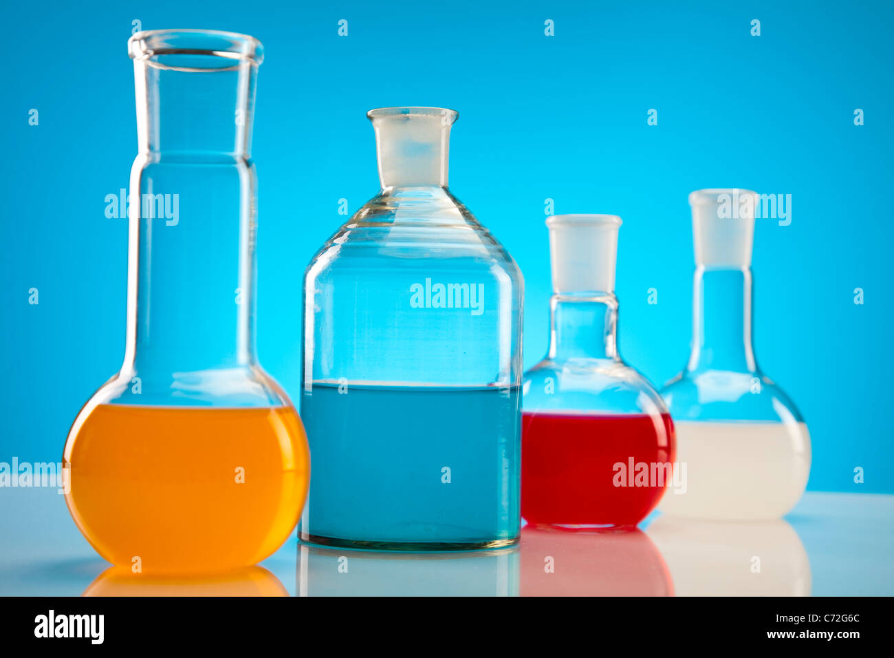 Laboratory flasks containing liquid color Stock Photo - Alamy