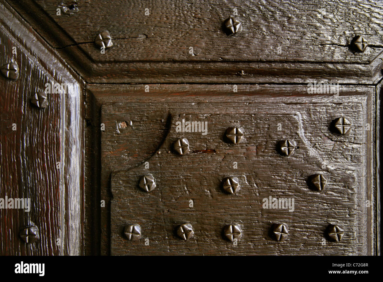Detail of old handmade screws and mitred joint in timber door Stock ...