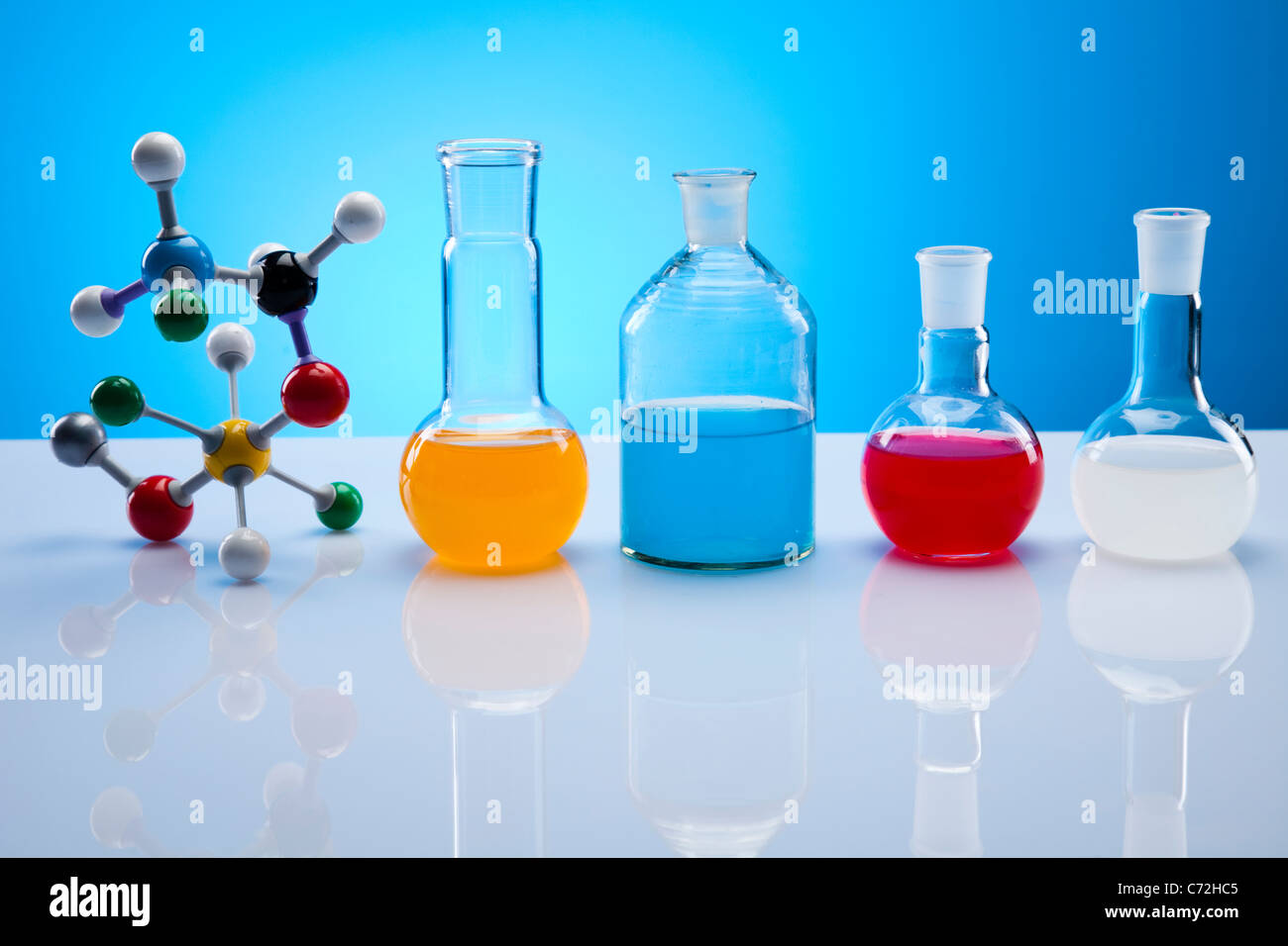 Molecular model and flasks in laboratory Stock Photo - Alamy