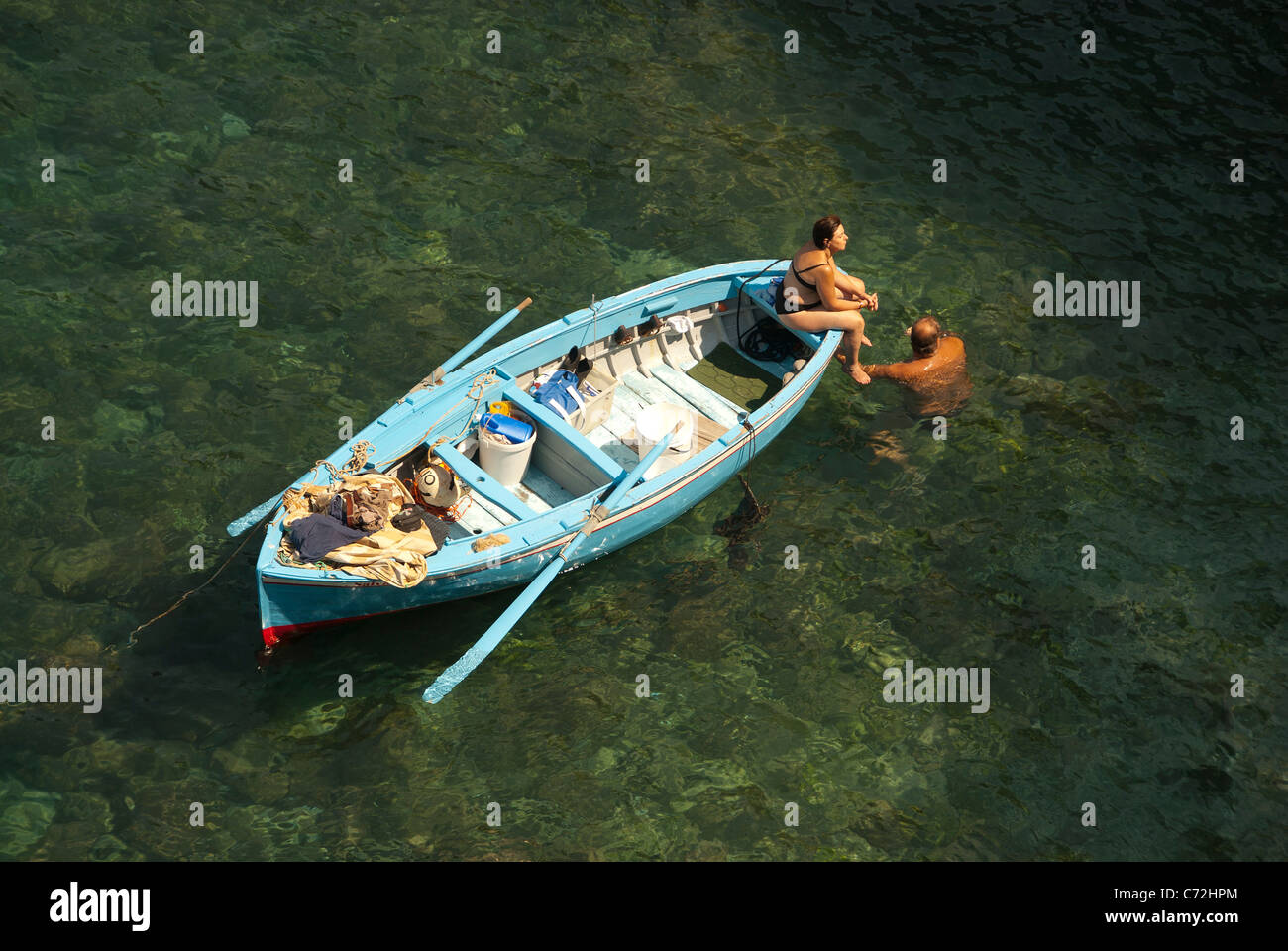 Couple relaxing in rowing boat Stock Photo - Alamy