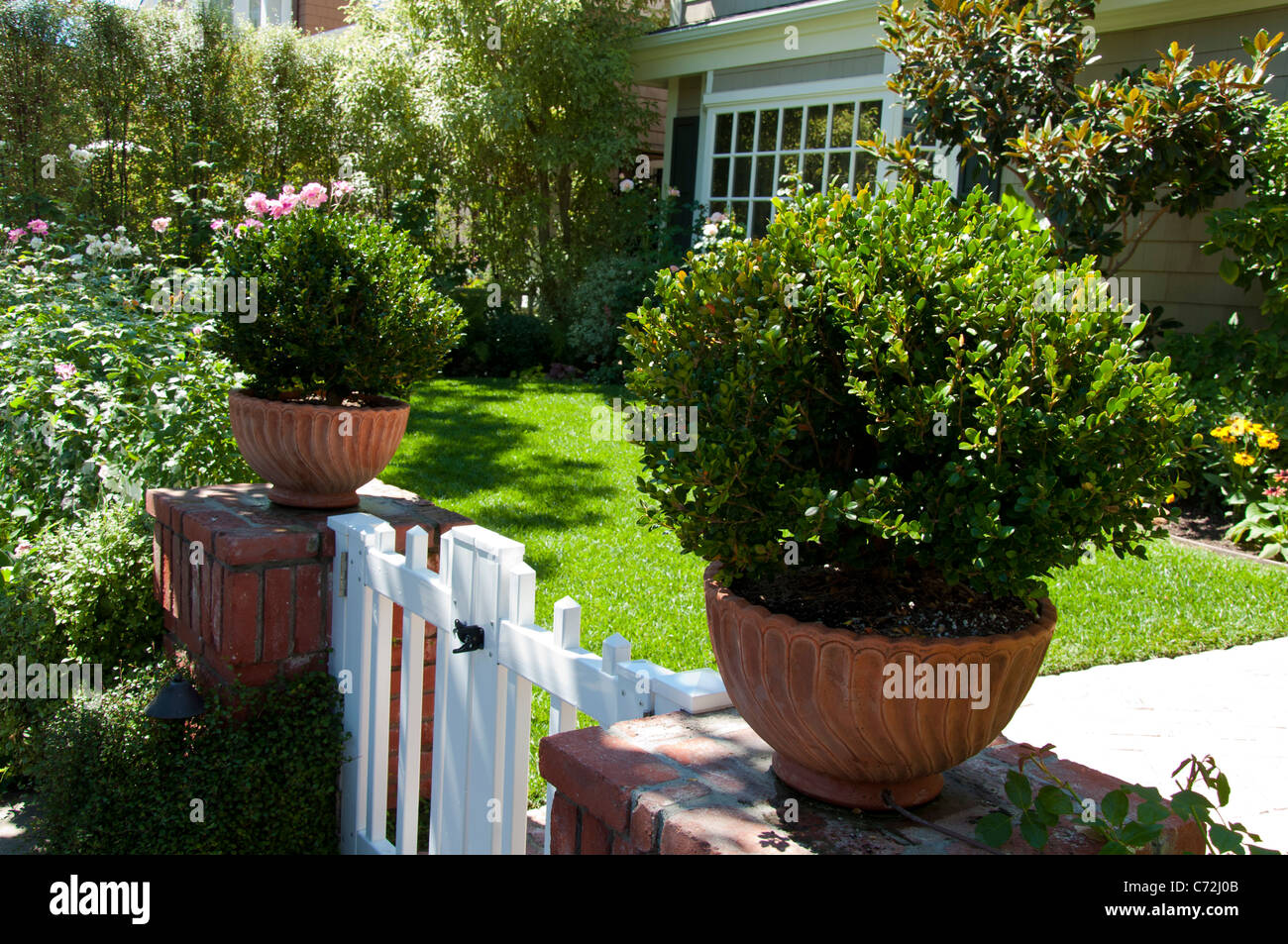 Cute white gate Stock Photo - Alamy