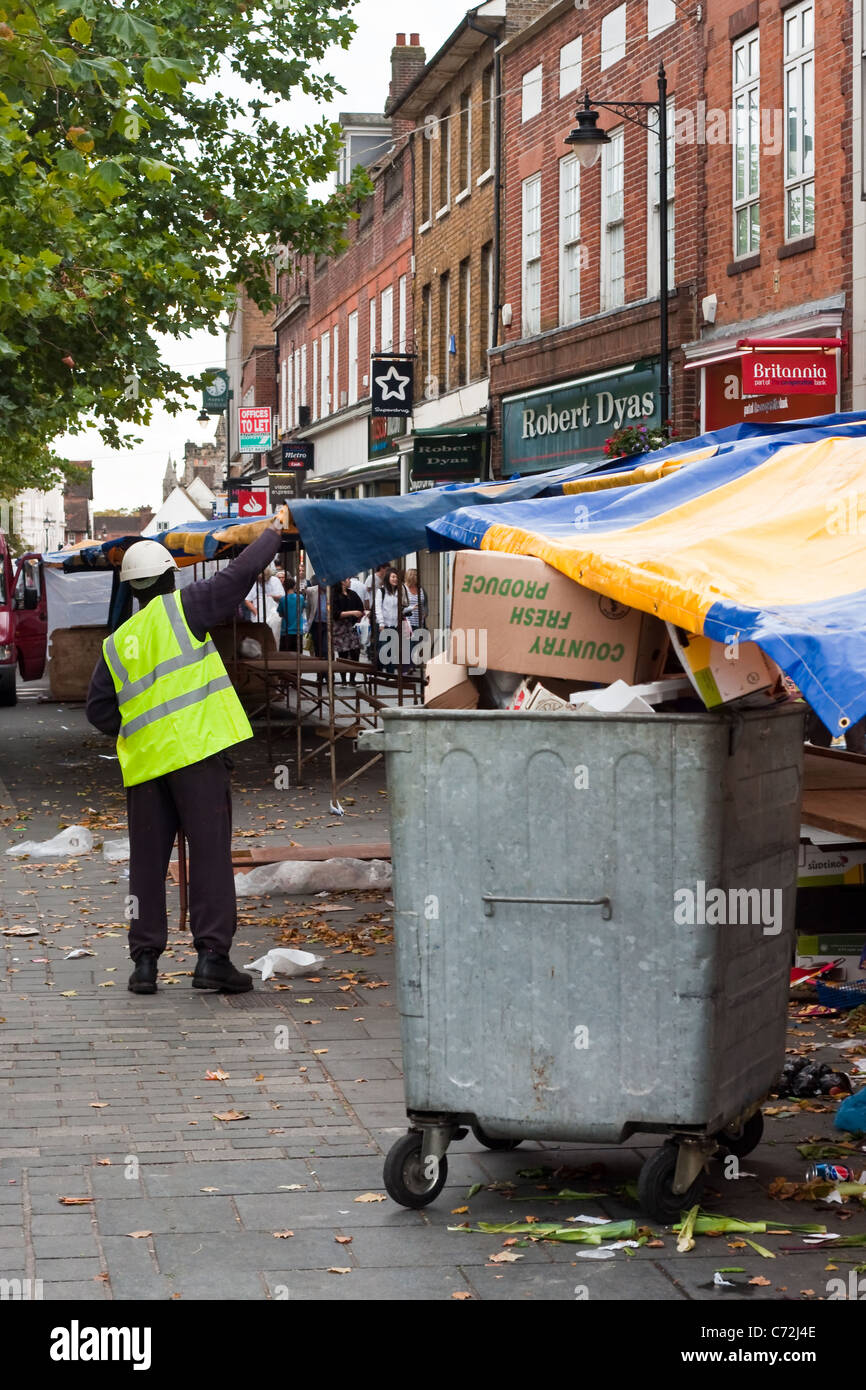 A male council worker at the the end of market day in St Albans ...