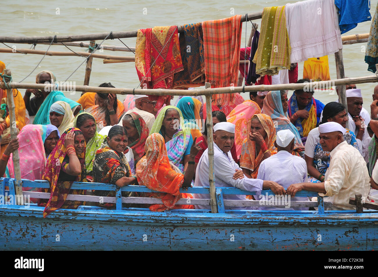 Pilgrims on the boat at Ganges river Stock Photo - Alamy