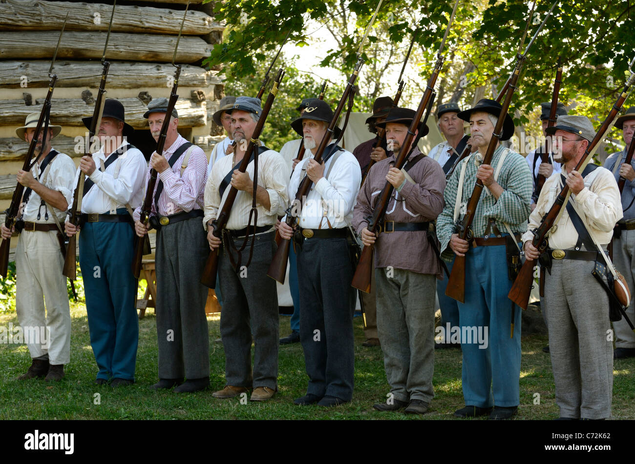 Company of conscripted Confederate soldiers at attention with muskets ...