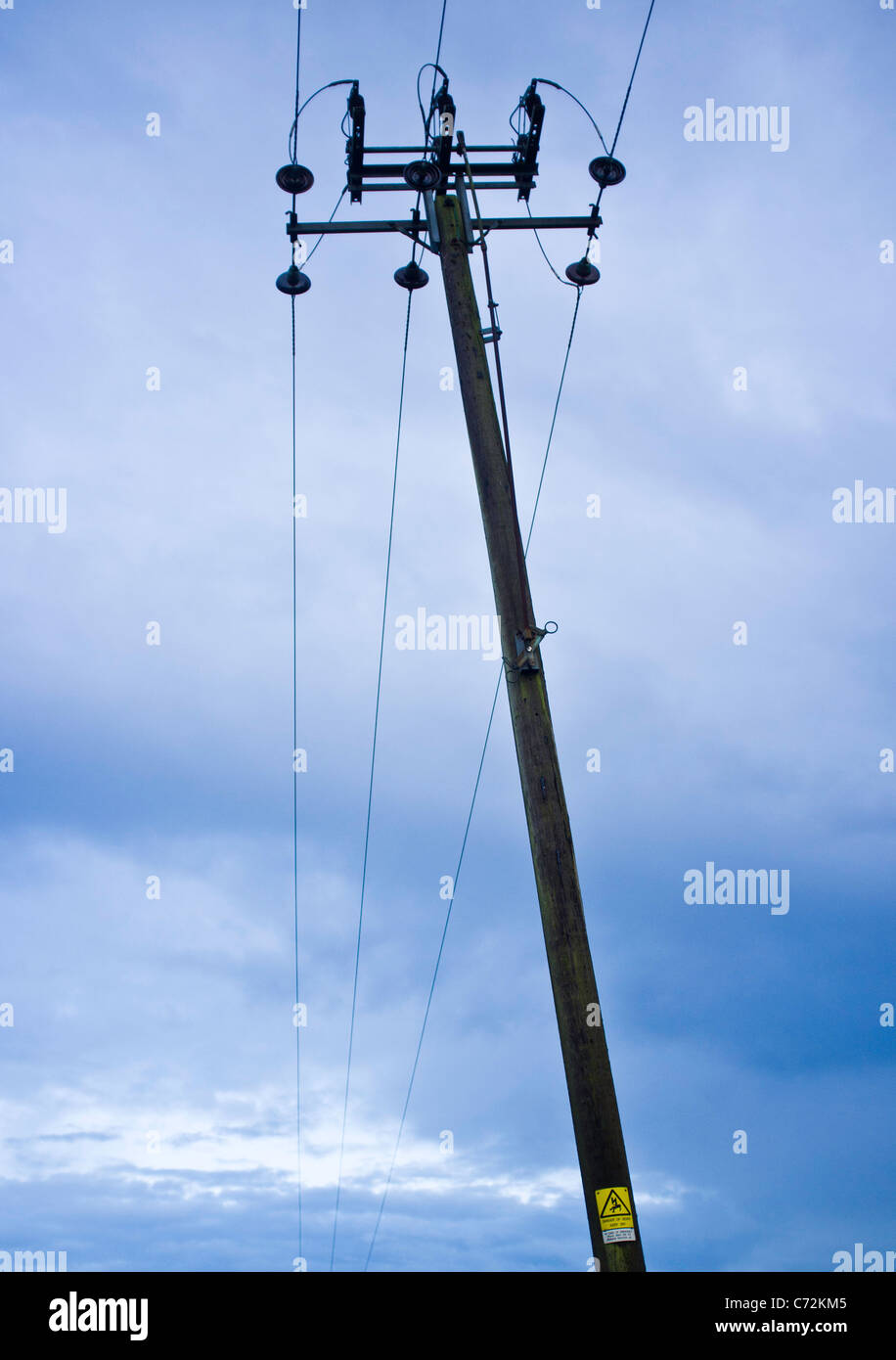 Telegraph pole against blue sky Stock Photo - Alamy