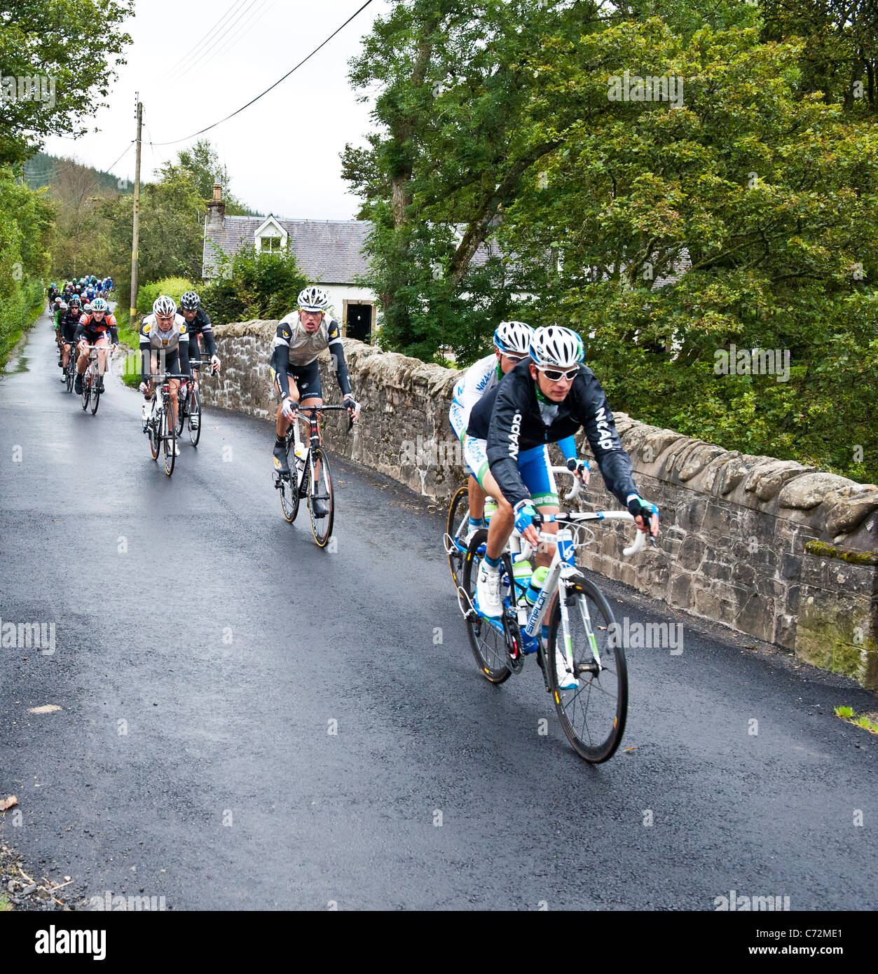 Tour of Britain Stage One - riders cross the River Tweed at Tweedsmuir ...