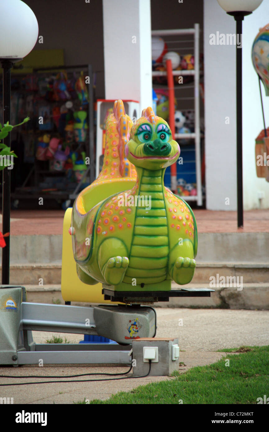 A dragon ride for children to play with Stock Photo - Alamy