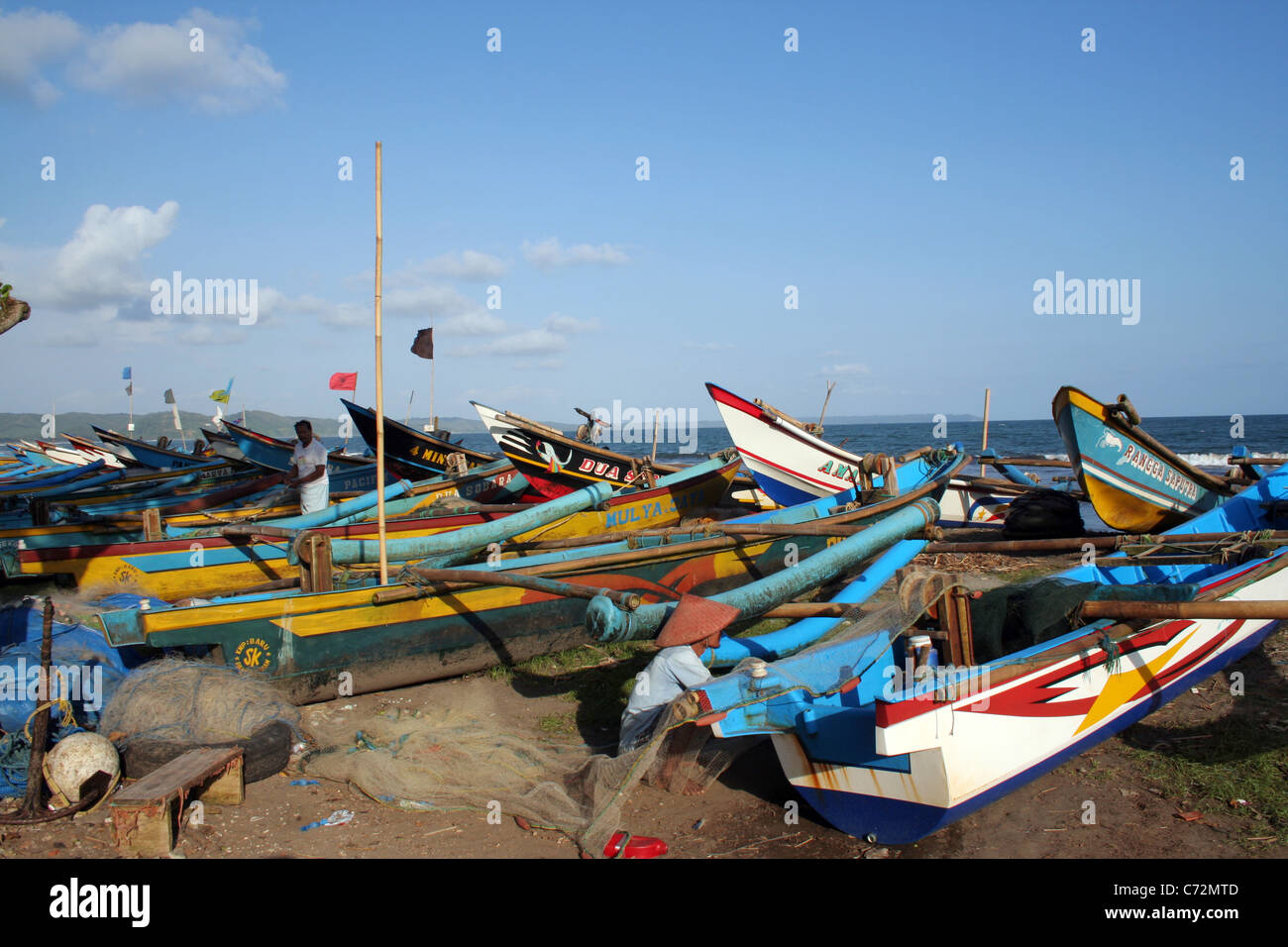 Colorful fishing boats on the beach of Pangandaran, Java, Indonesia ...