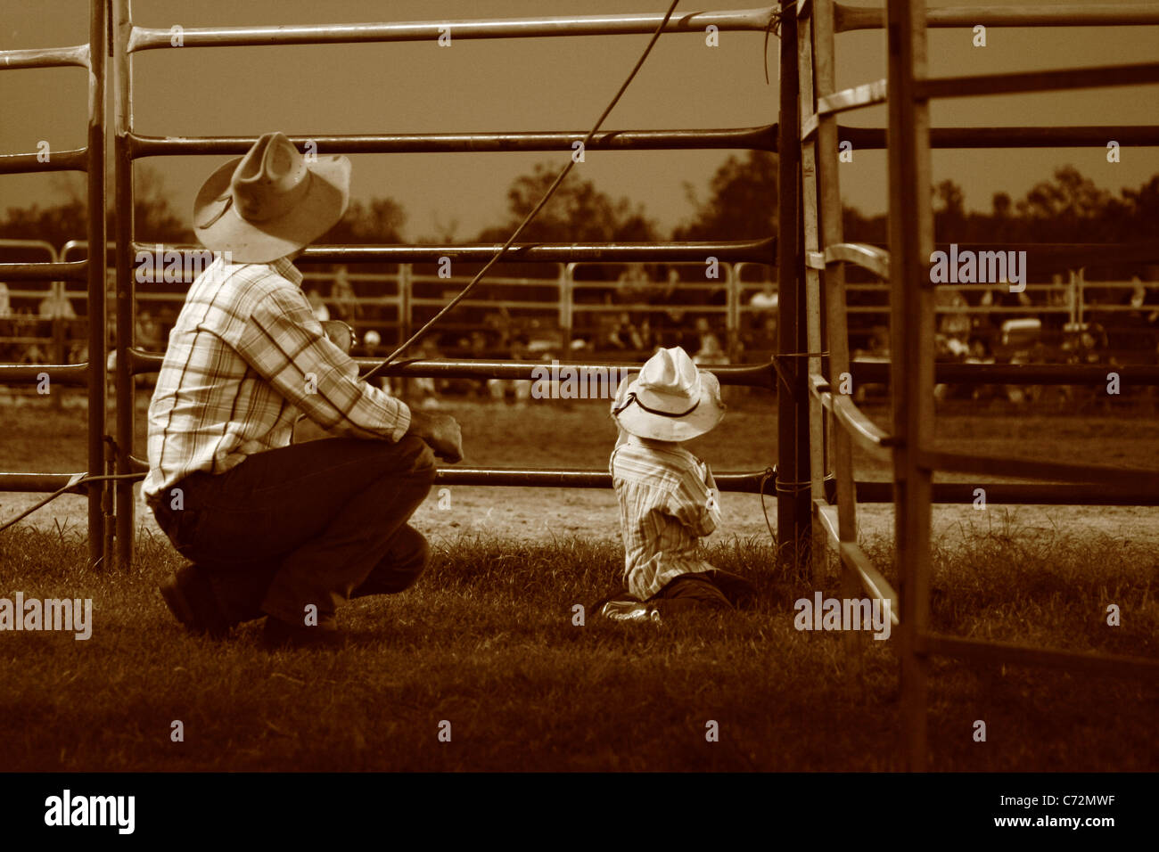 Father and son watching a rodeo in Queensland, Australia Stock Photo ...