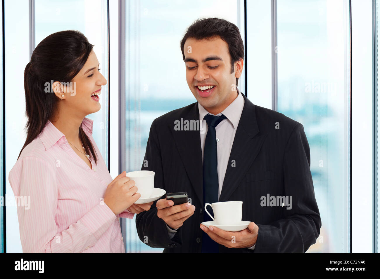 Businessman and executive laughing Stock Photo - Alamy