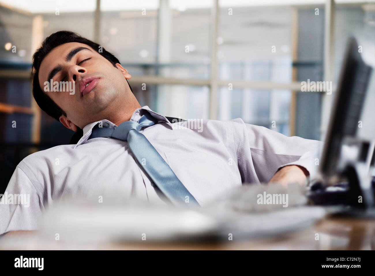 Businessman sleeping in the office Stock Photo - Alamy