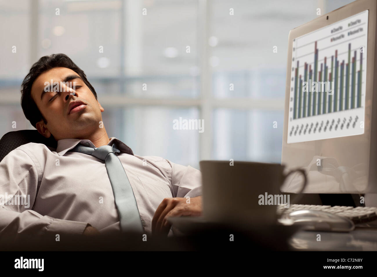 Businessman sleeping in the office Stock Photo - Alamy