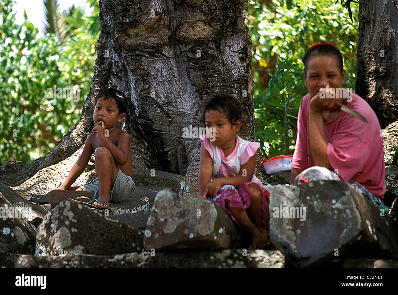Local people resting near the ruined c ity of Nan Madol on Pohnpei ...