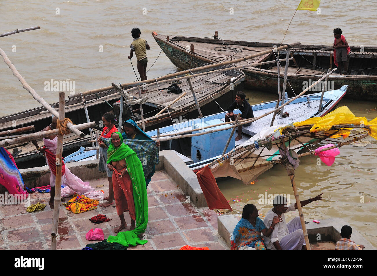 Pilgrims at the ghat by the Ganges river Stock Photo - Alamy