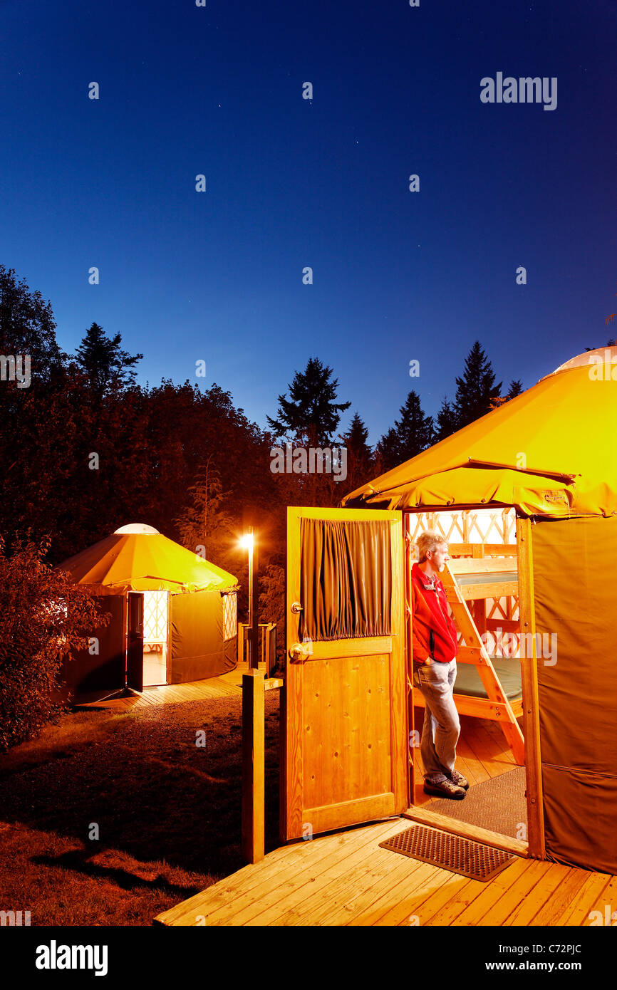Man standing in open doorway of rental yurts at Kayak Point County Park ...