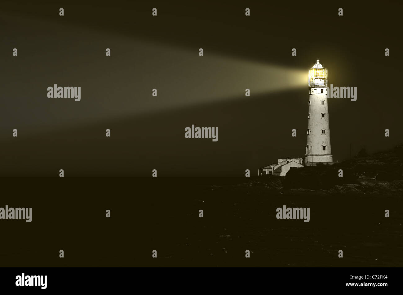 lighthouse at night: beam of light over sea Stock Photo - Alamy
