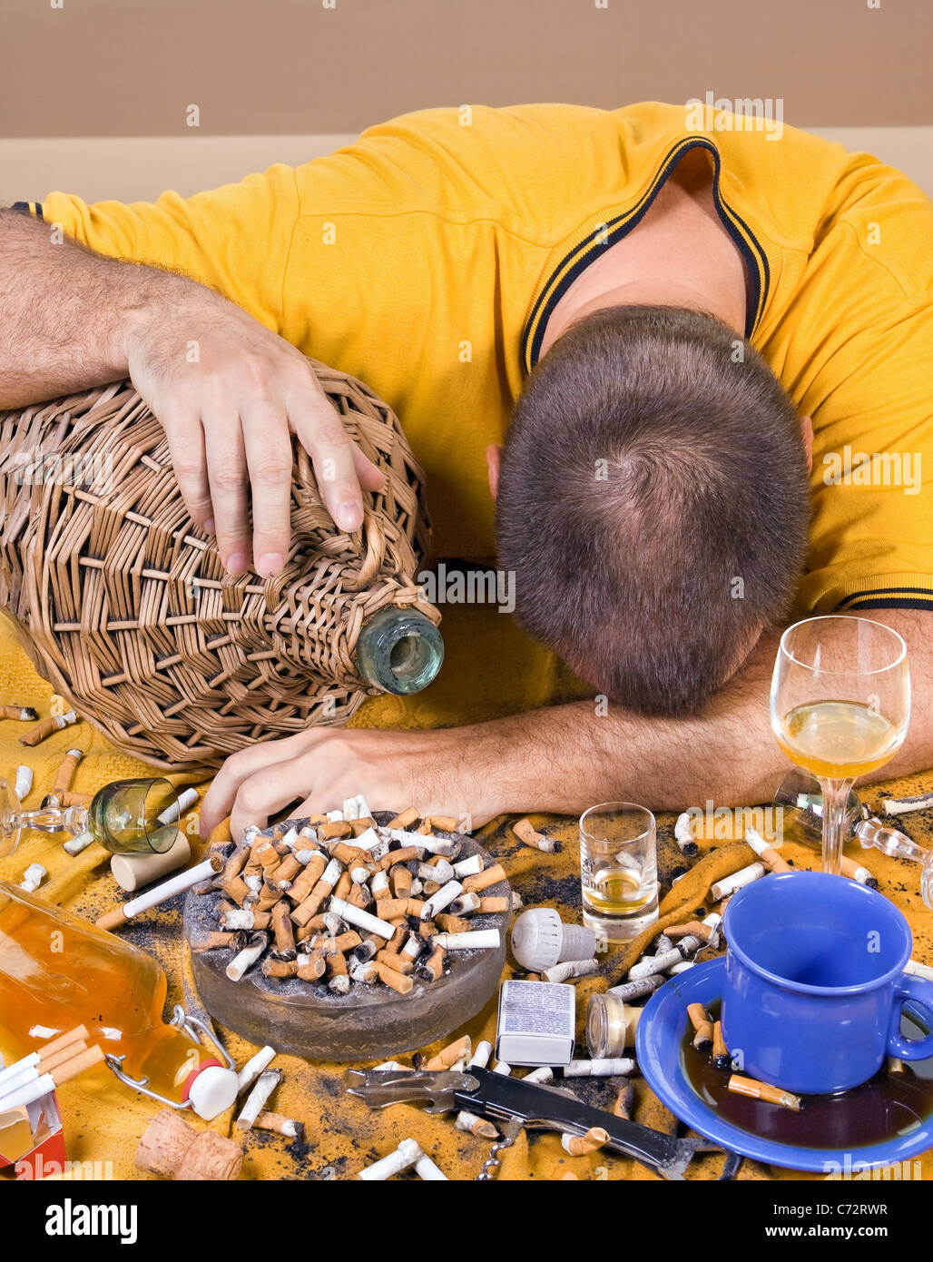Drunk man sleeping on the table Stock Photo - Alamy