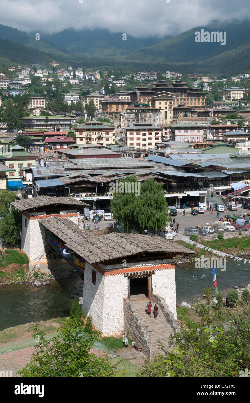 Skyline of Thimpu with traditional bridge in frgd. Bhutan Stock Photo ...