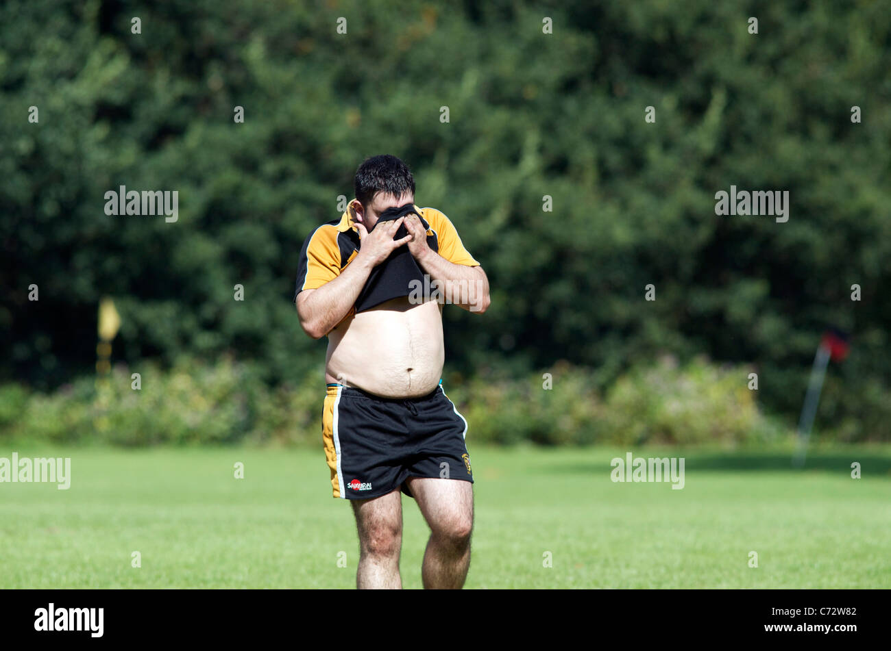 rugby player wipes sweat from his face Stock Photo - Alamy