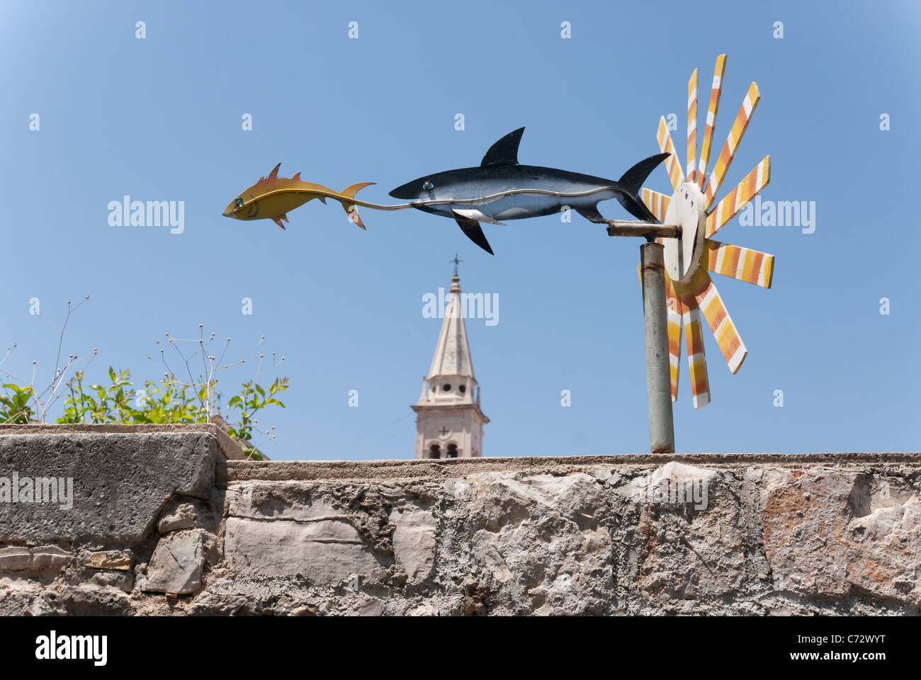 a wind chime where one fish is hunting another Stock Photo - Alamy