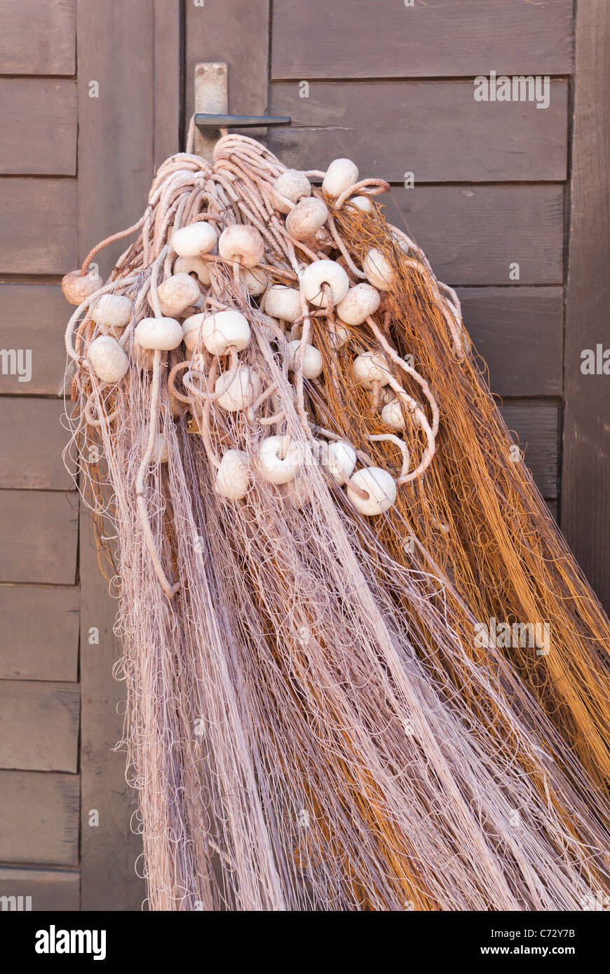 a macro of a fishing net hanging in the sun to dry Stock Photo - Alamy