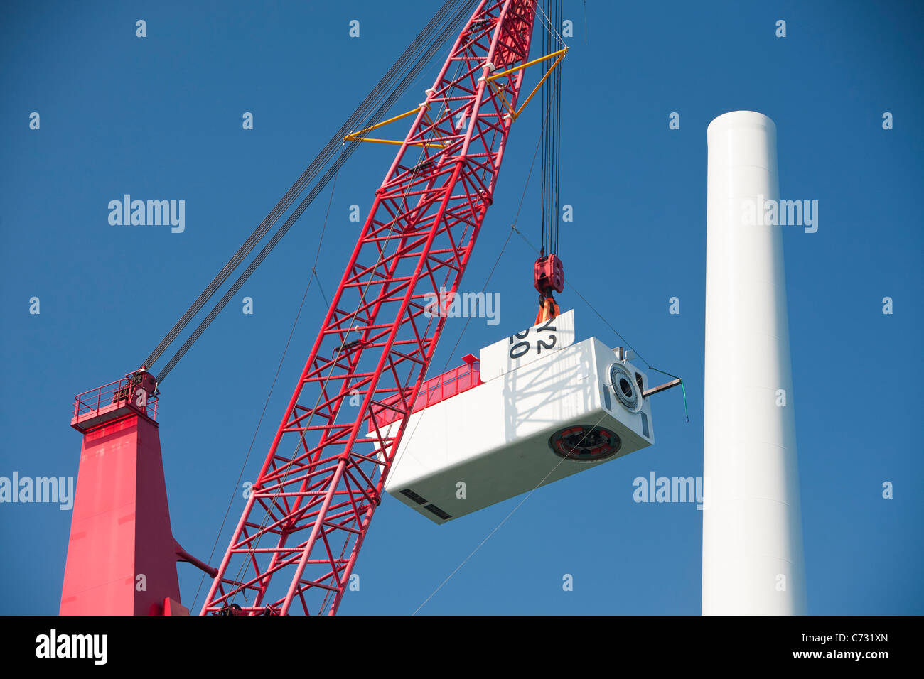 A nacelle being lifted onto an wind turbine tower on the Walney ...