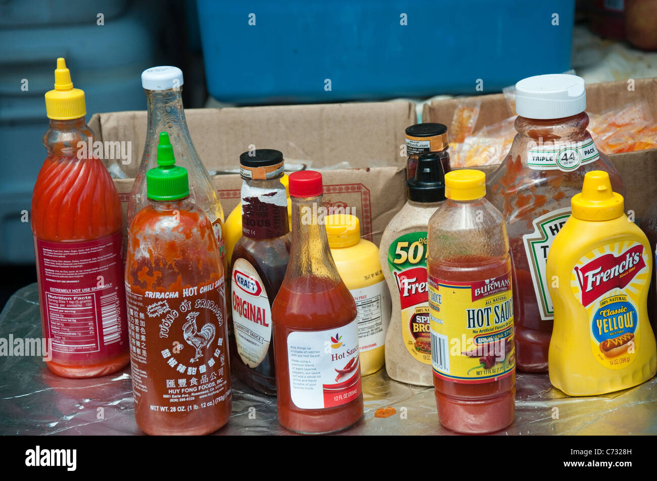 Sauce and dressing bottles on a food stall at Artscape in Baltimore ...