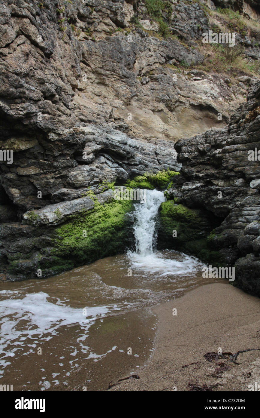 A small waterfall at Arch Rock in Point Reyes, California Stock Photo ...