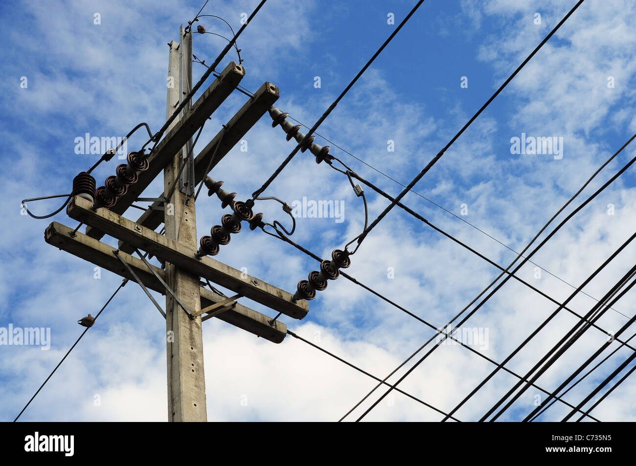 electricity post in blue sky Stock Photo - Alamy