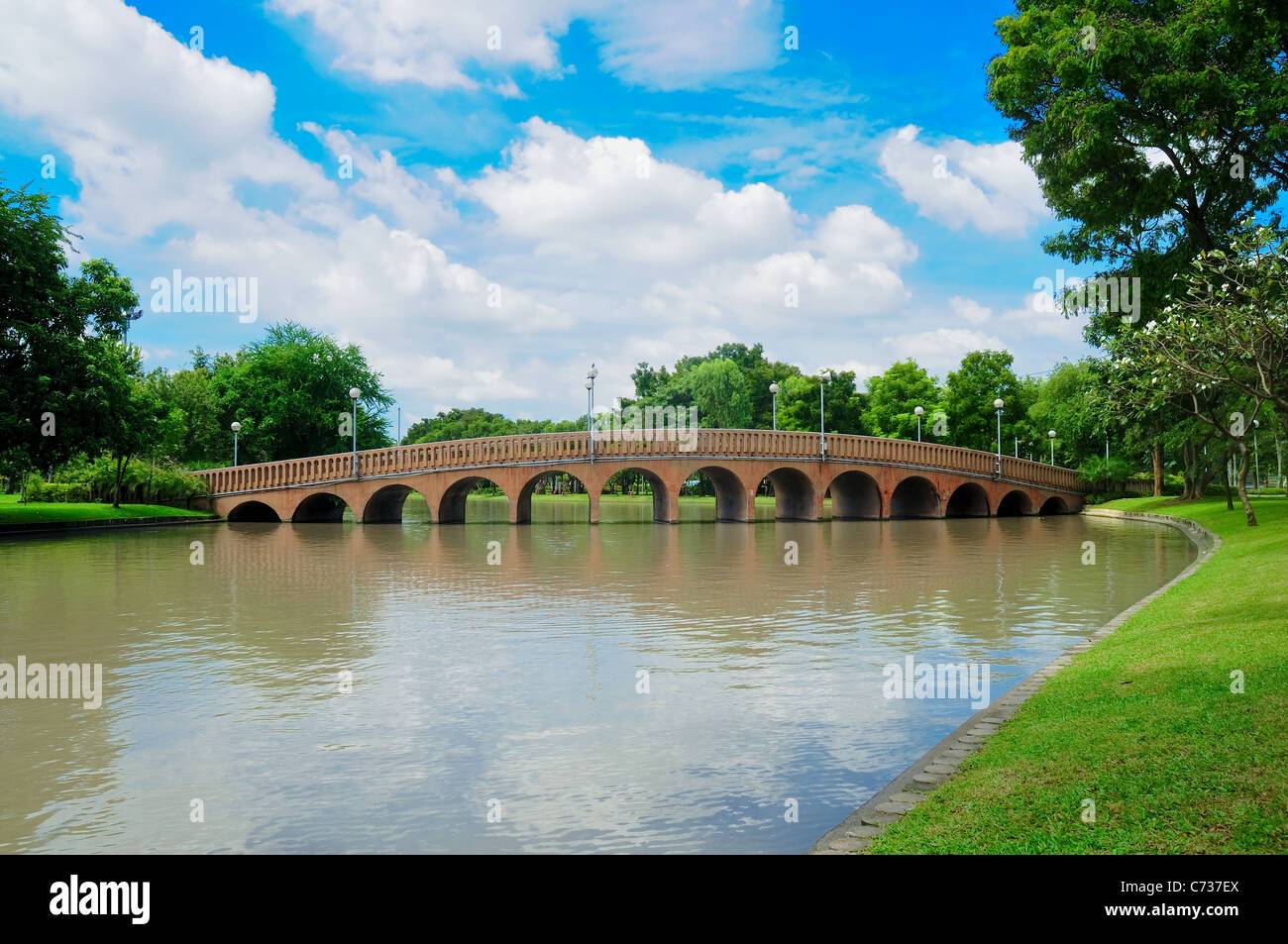 footbridge and its reflection in a park Stock Photo - Alamy
