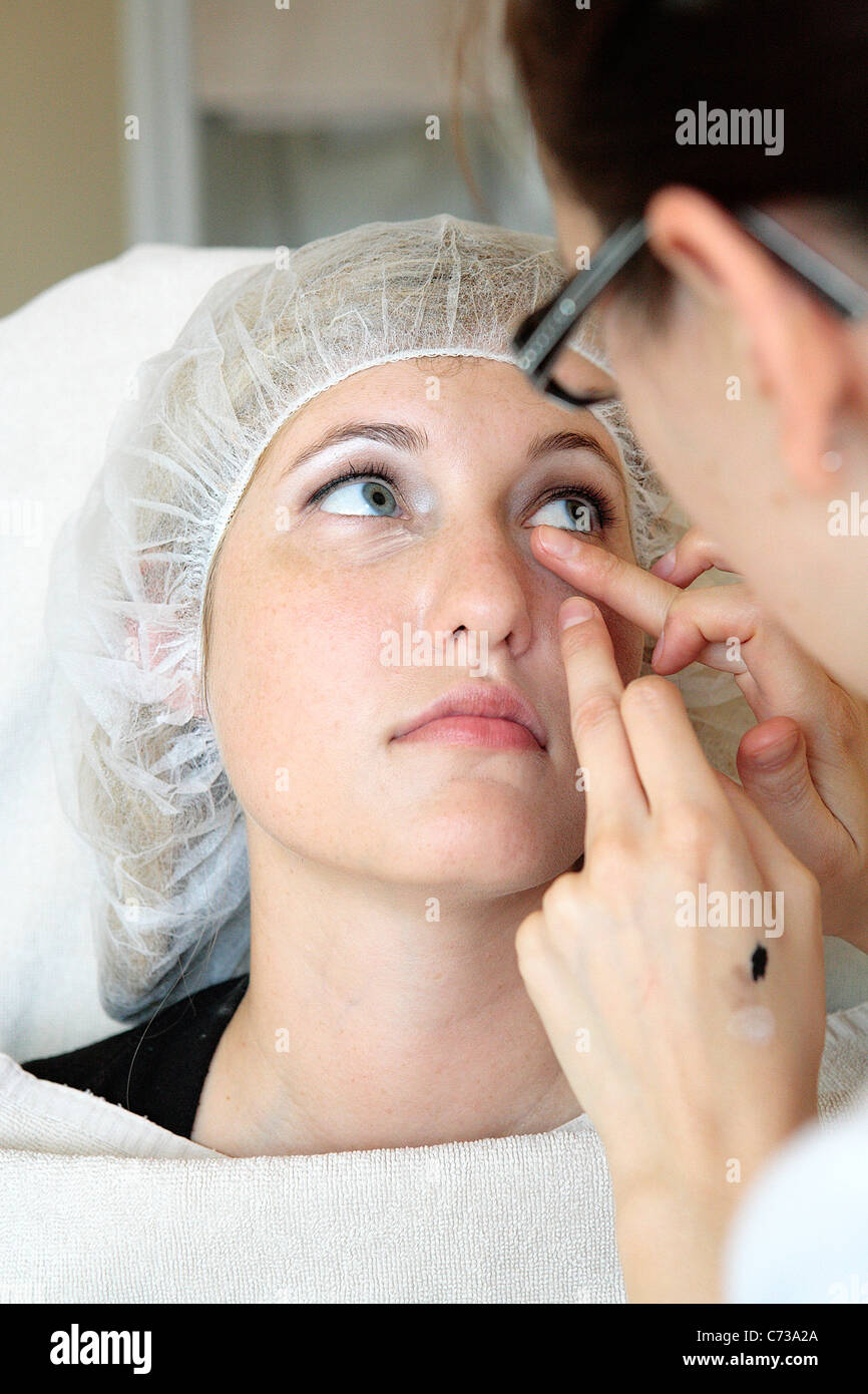 25 year old german bride is getting her make-up for wedding ceremony ...