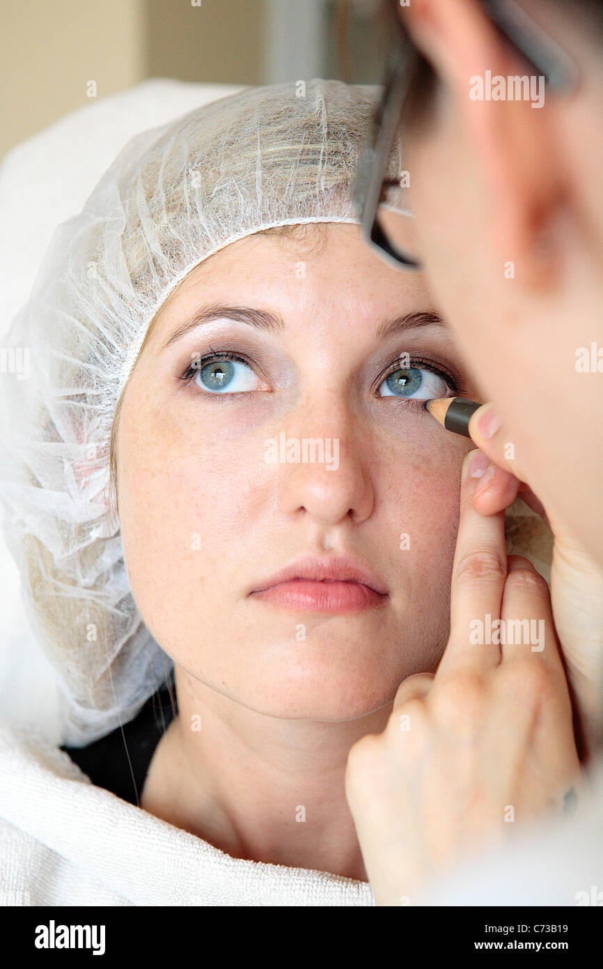 25 year old german bride is getting her make-up for wedding ceremony ...
