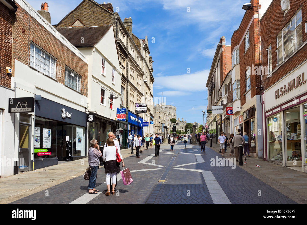 Shops on Peascod Street in the town centre with Windsor Castle in the ...