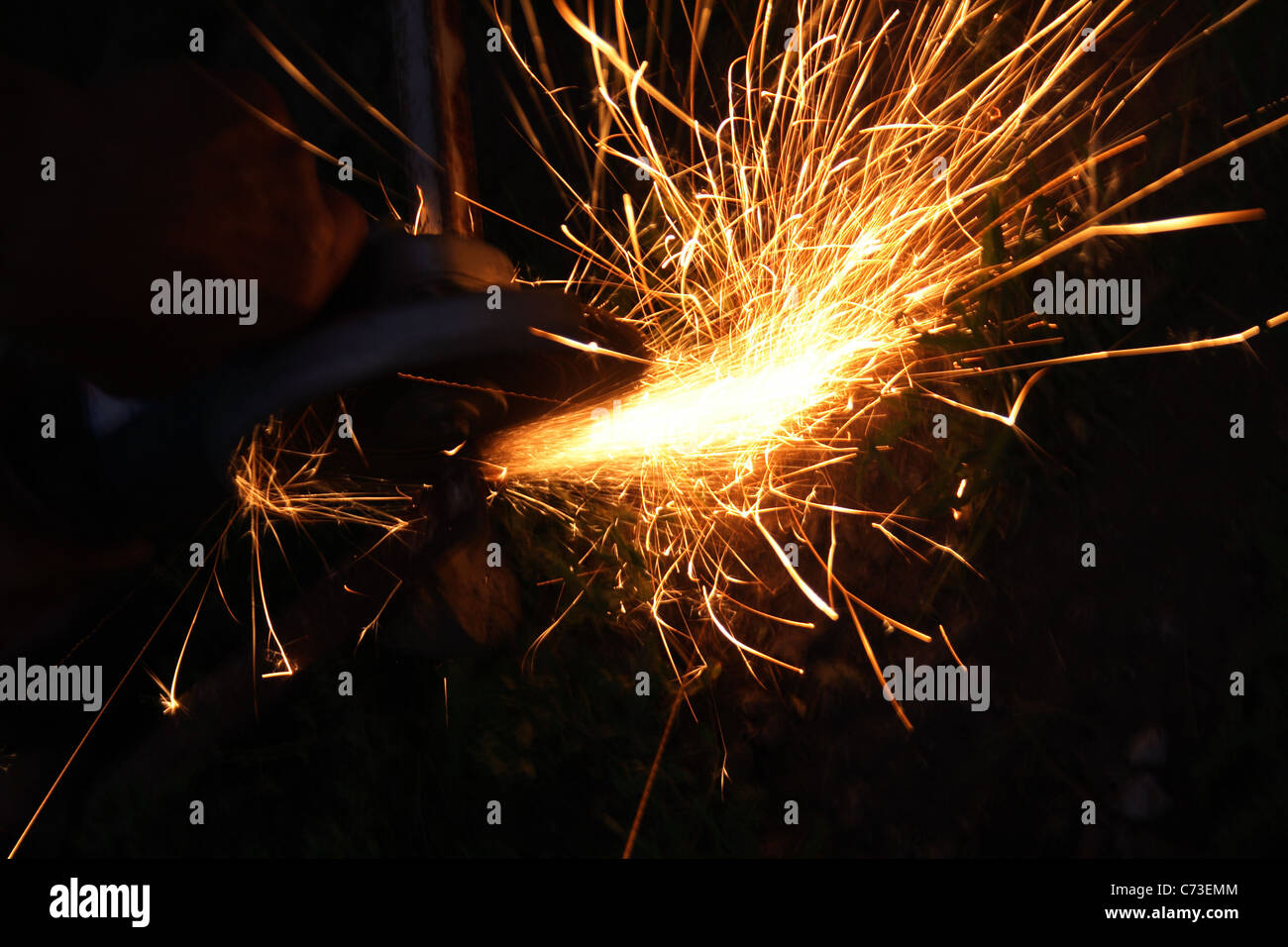 Sparks fly in directions cutting hi-res stock photography and images ...