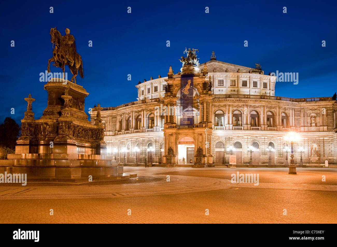 Semper Opera House at night, with equestrian statue of King John ...
